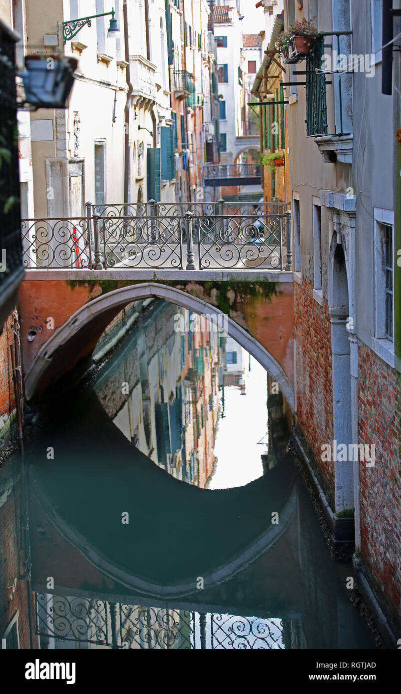 one of the many bridges of the island of Venice in Italy with the ...
