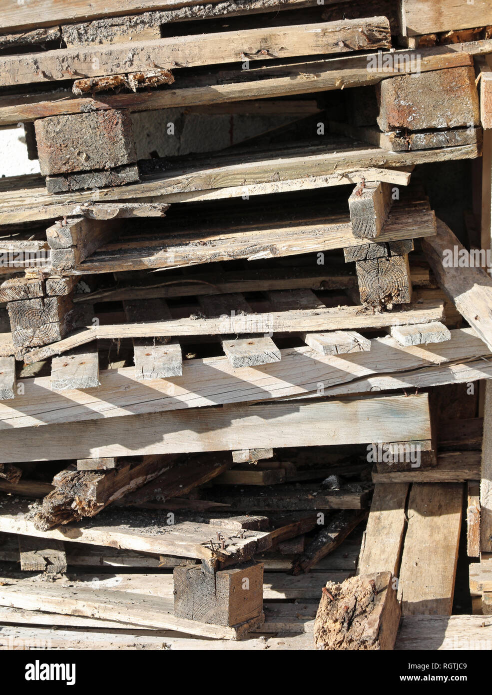 abandoned wooden boards of the old pallets used to transport the goods ...