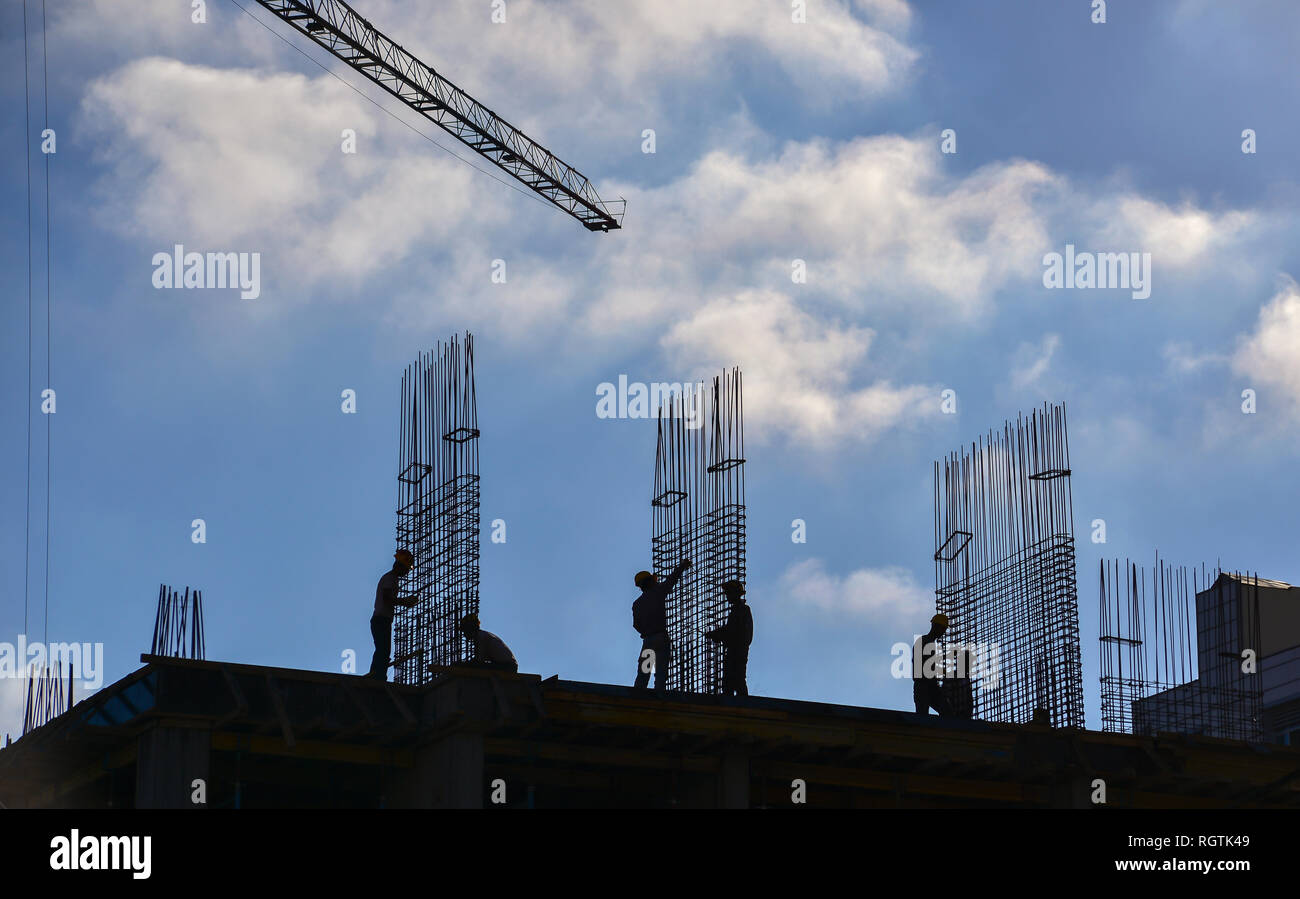 Silhouette of people working and building construction Stock Photo - Alamy