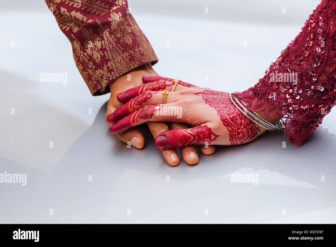 traditional henna designs on the hands of a young married woman in ...