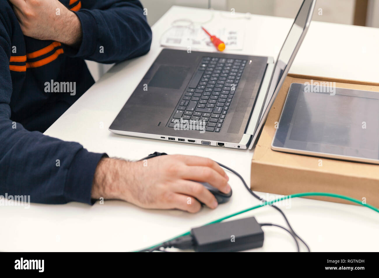 engineer working on the laptop in the factory Stock Photo - Alamy