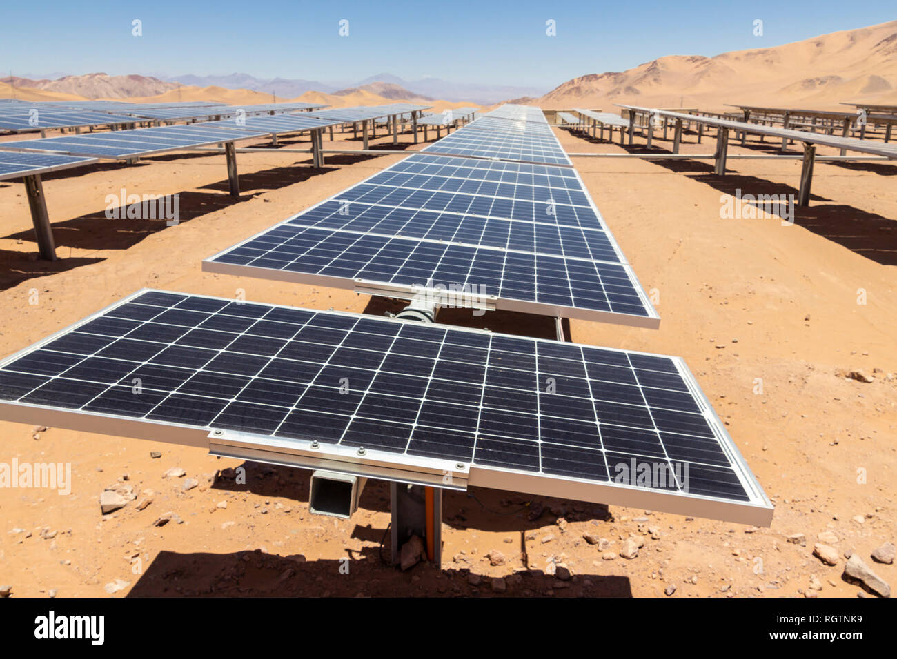 Hundreds solar energy panels rows along the dry lands at Atacama Desert ...