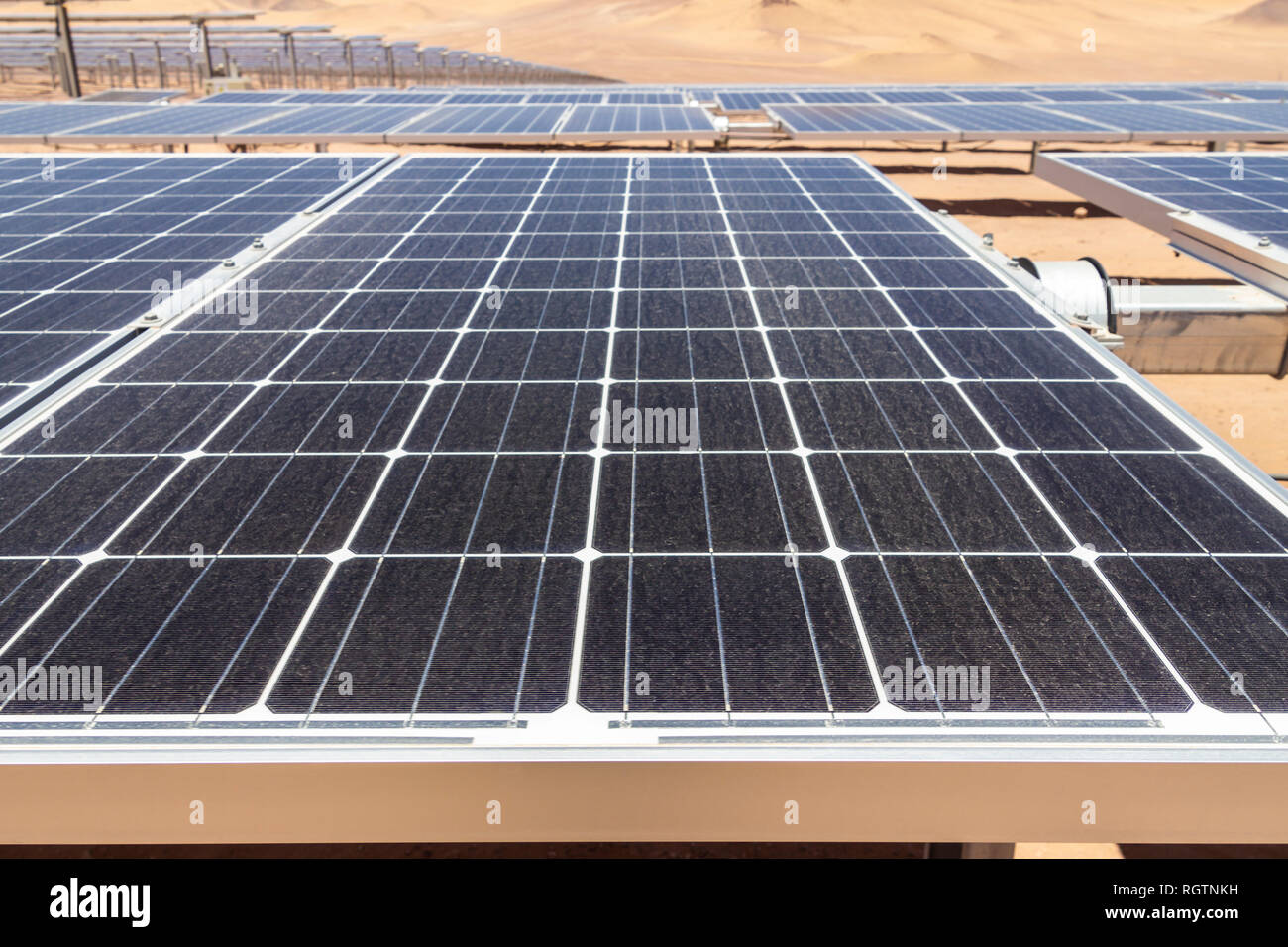 Hundreds solar energy modules or panels rows along the dry lands at ...