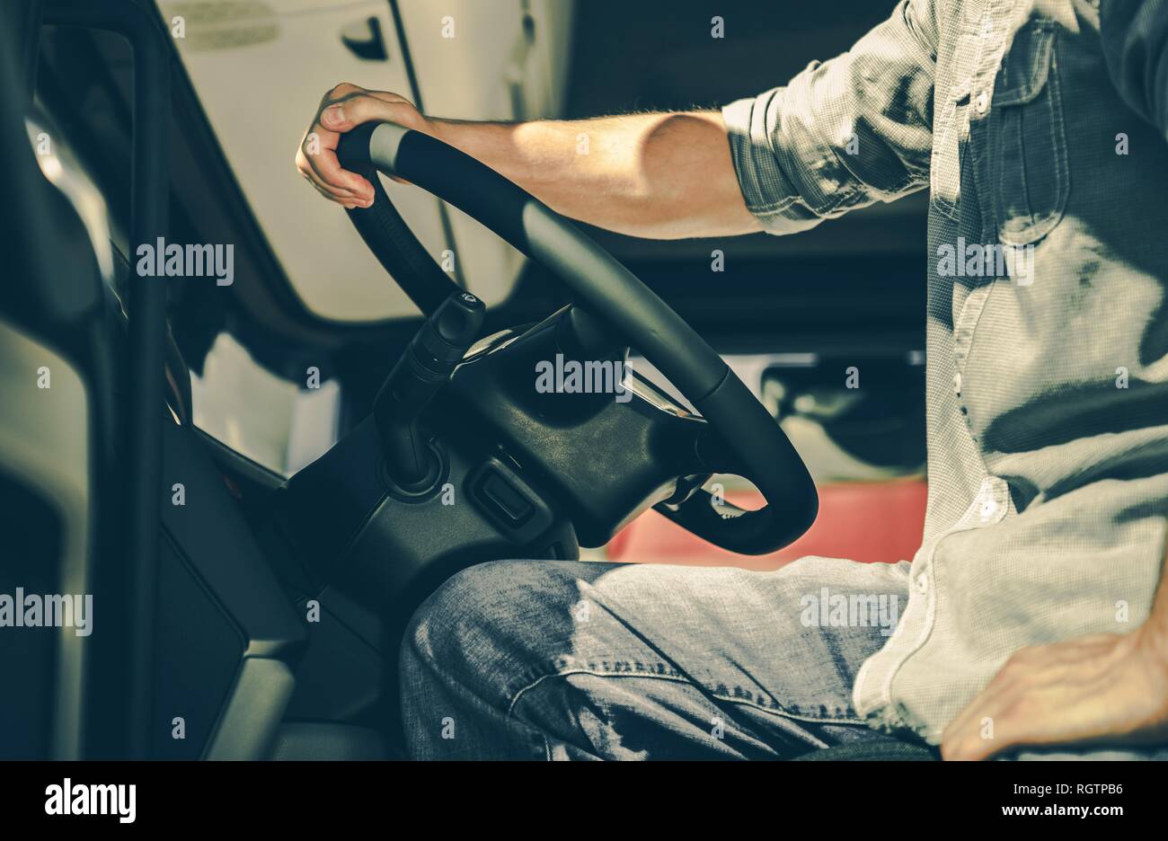 Caucasian Semi Truck Driver Behind the Wheel. Transportation Industry ...