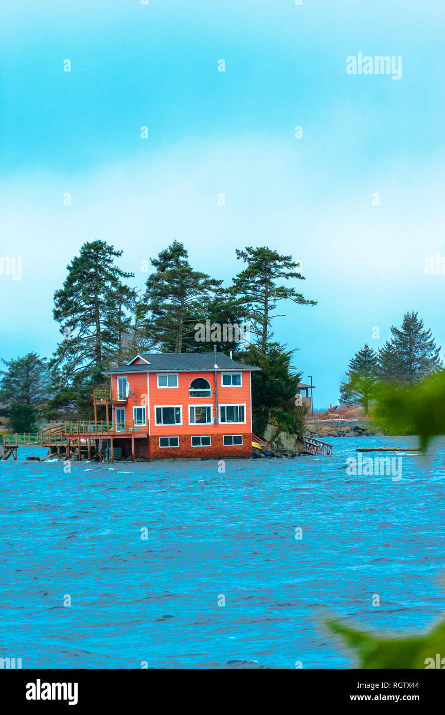 Tourist cabin on small tidal island in Sitka, Alaska, USA Stock Photo ...