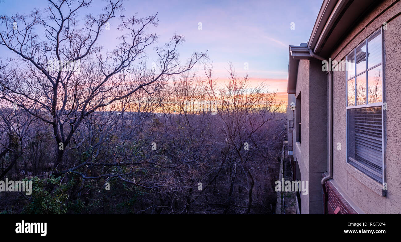 Panorama view typical park side apartment complex during winter sunrise ...
