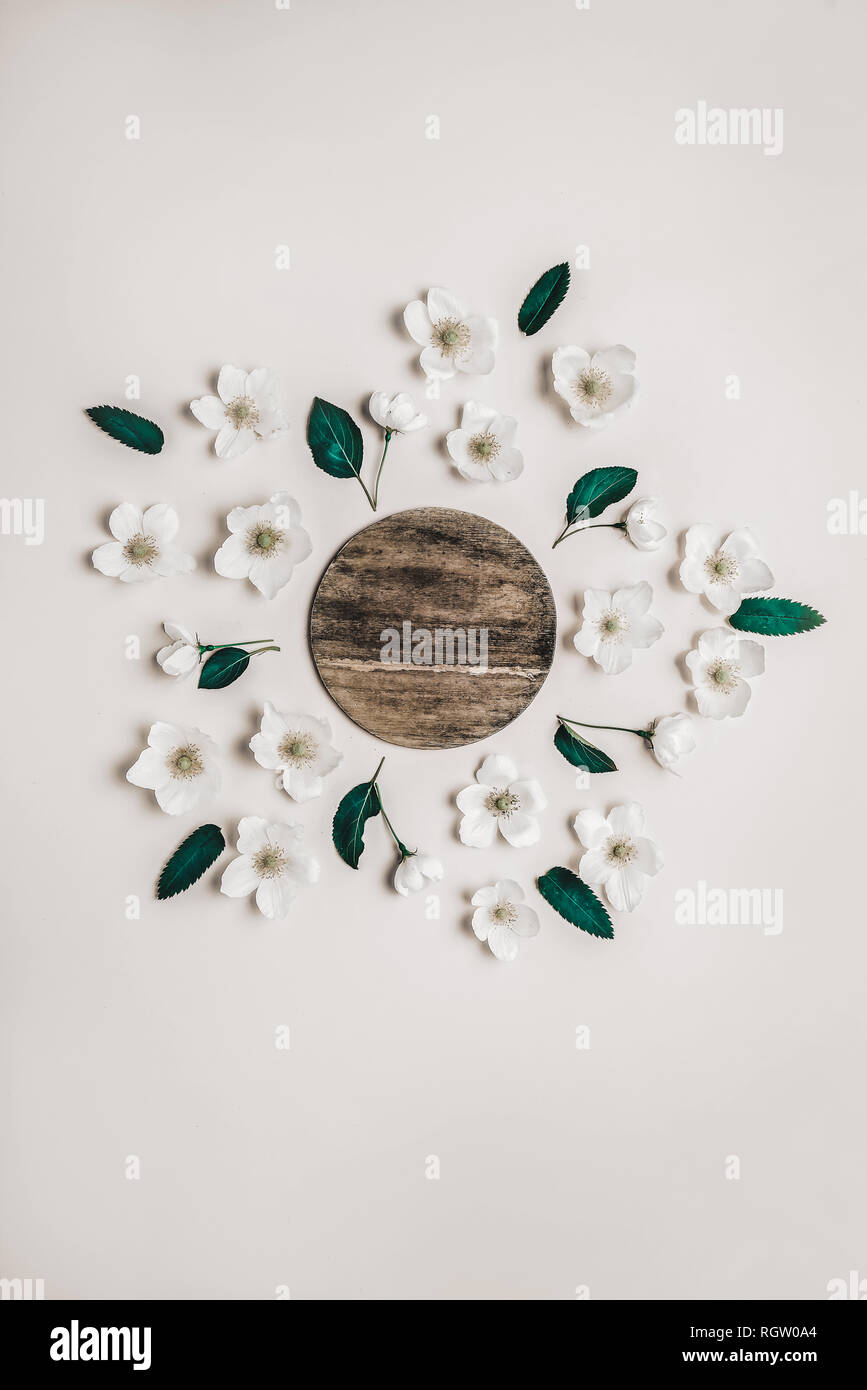 Creative layout of white flowers and plants with copy space for writing ...