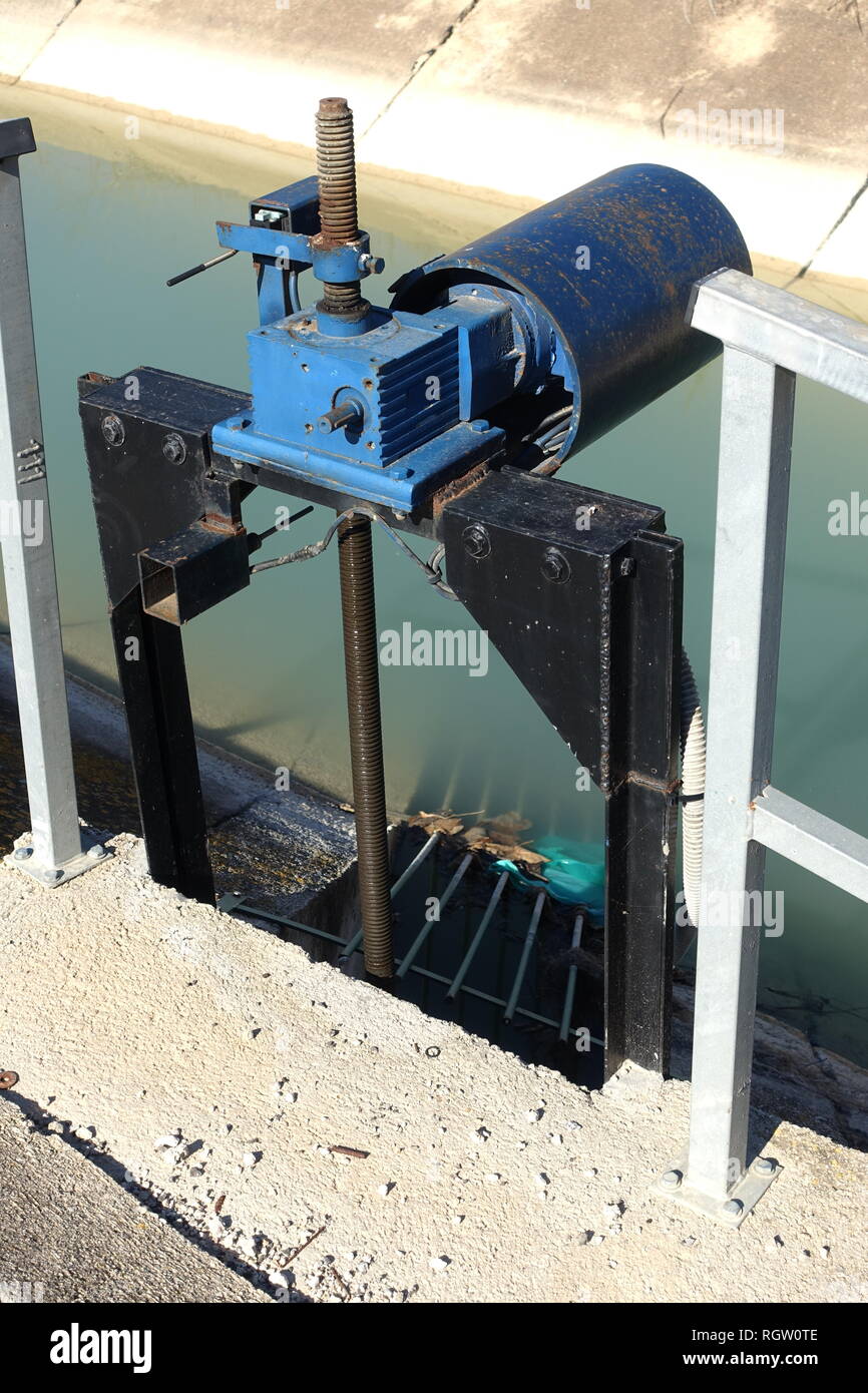 motorised sluice gate on aquaduct feeding local farms in Spain Stock ...