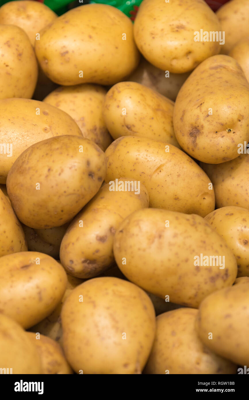 A selection of loose potatoes on sale in a supermarket in the UK Stock ...