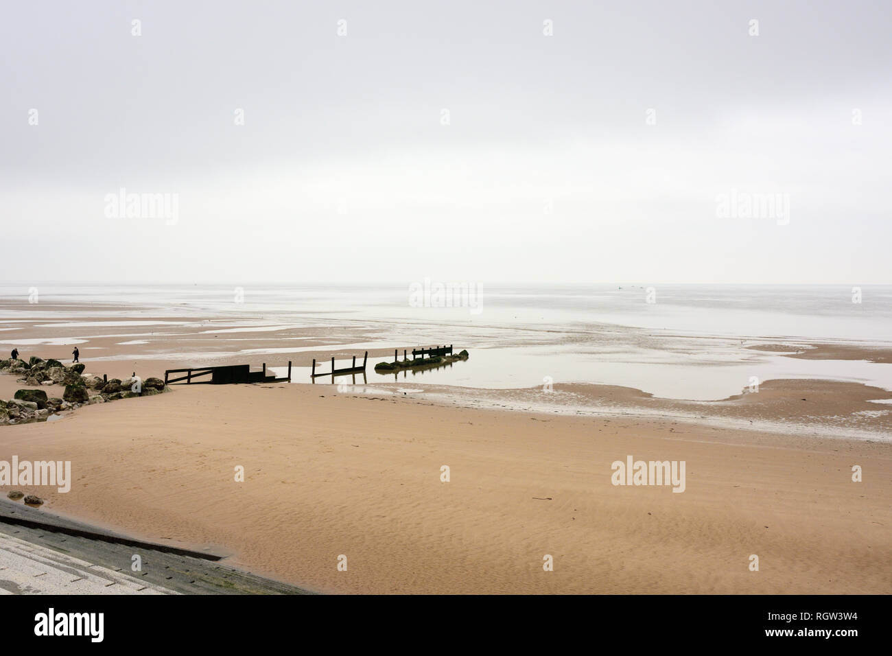Cleveleys beach at low tide with remains of damaged wooden groyne, on ...