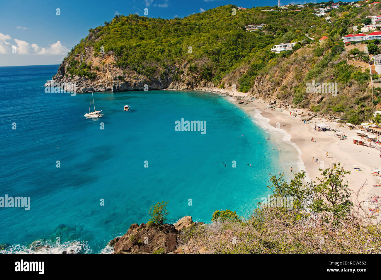 Sea beach with blue water, white sand and mountain landscape in ...