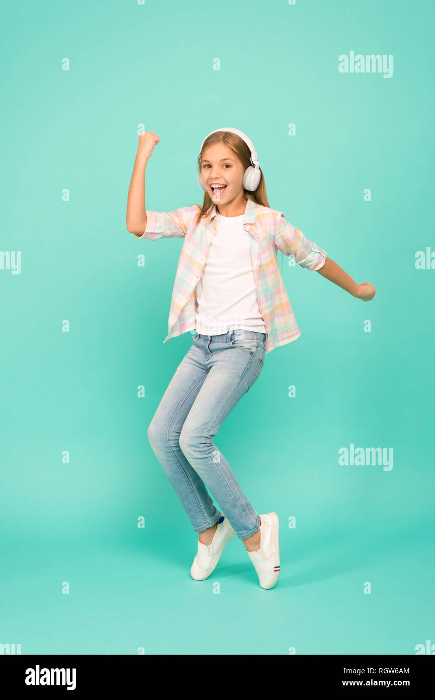 Music is happiness for her. Dancing girl. Happy small girl dancing to ...