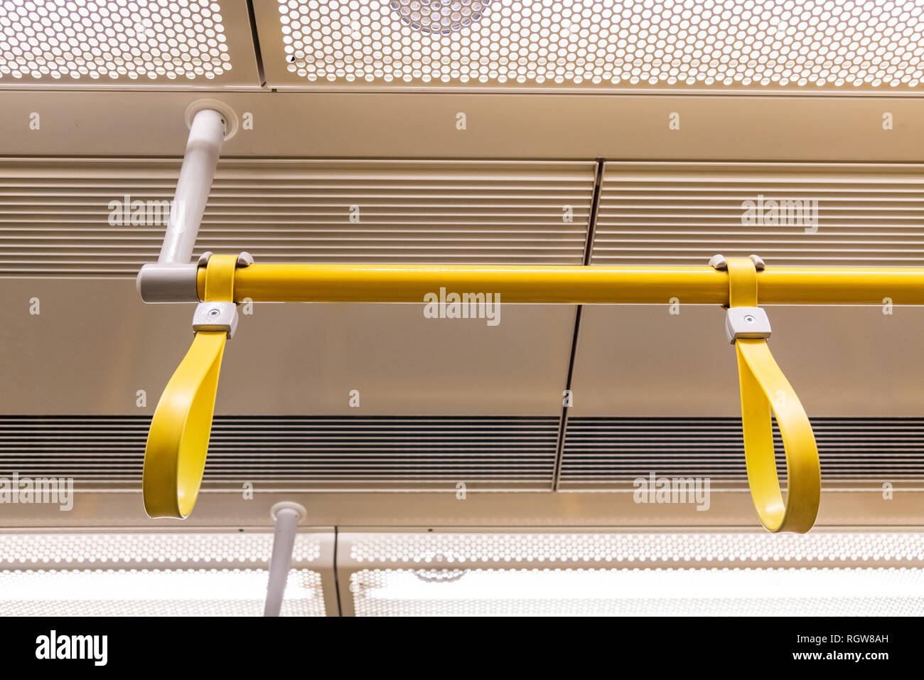 Yellow Handles on the London underground subway train Stock Photo - Alamy