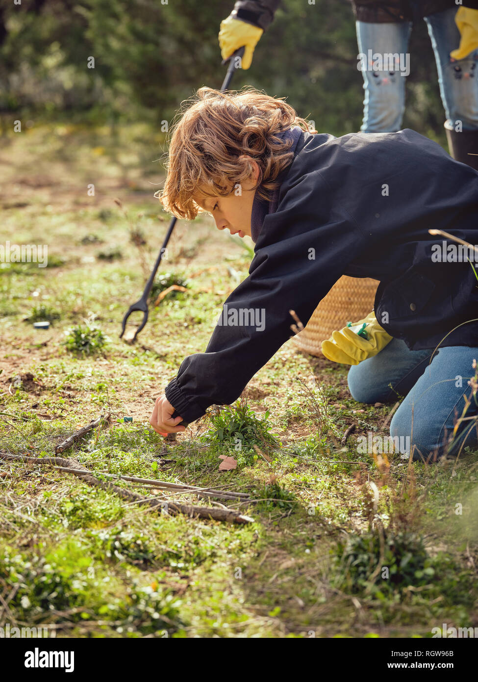Child Picking Garbage High Resolution Stock Photography and Images - Alamy