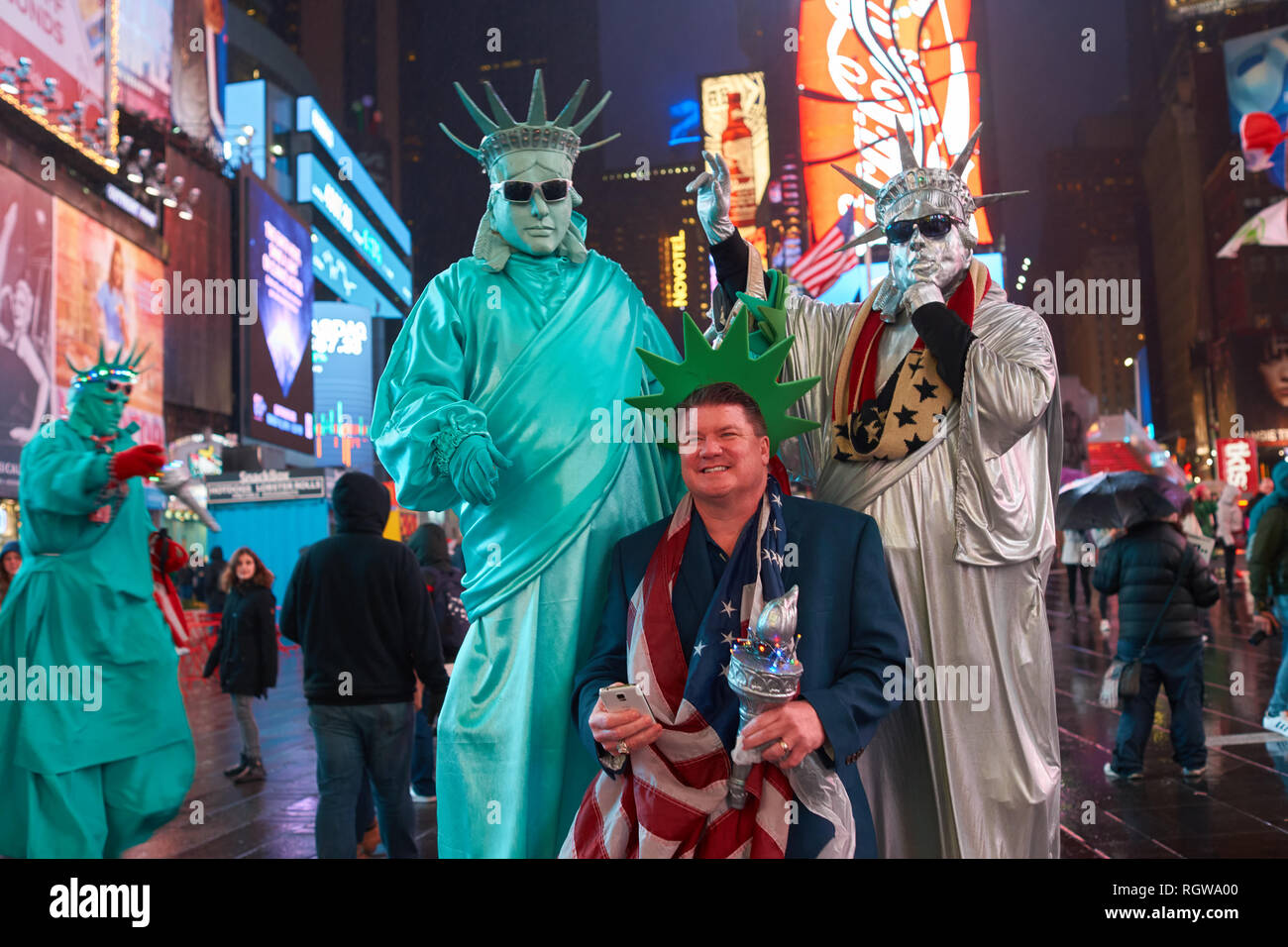 NEW YORK, NY - MARCH 14, 2016: man posing for taking photo at Times ...