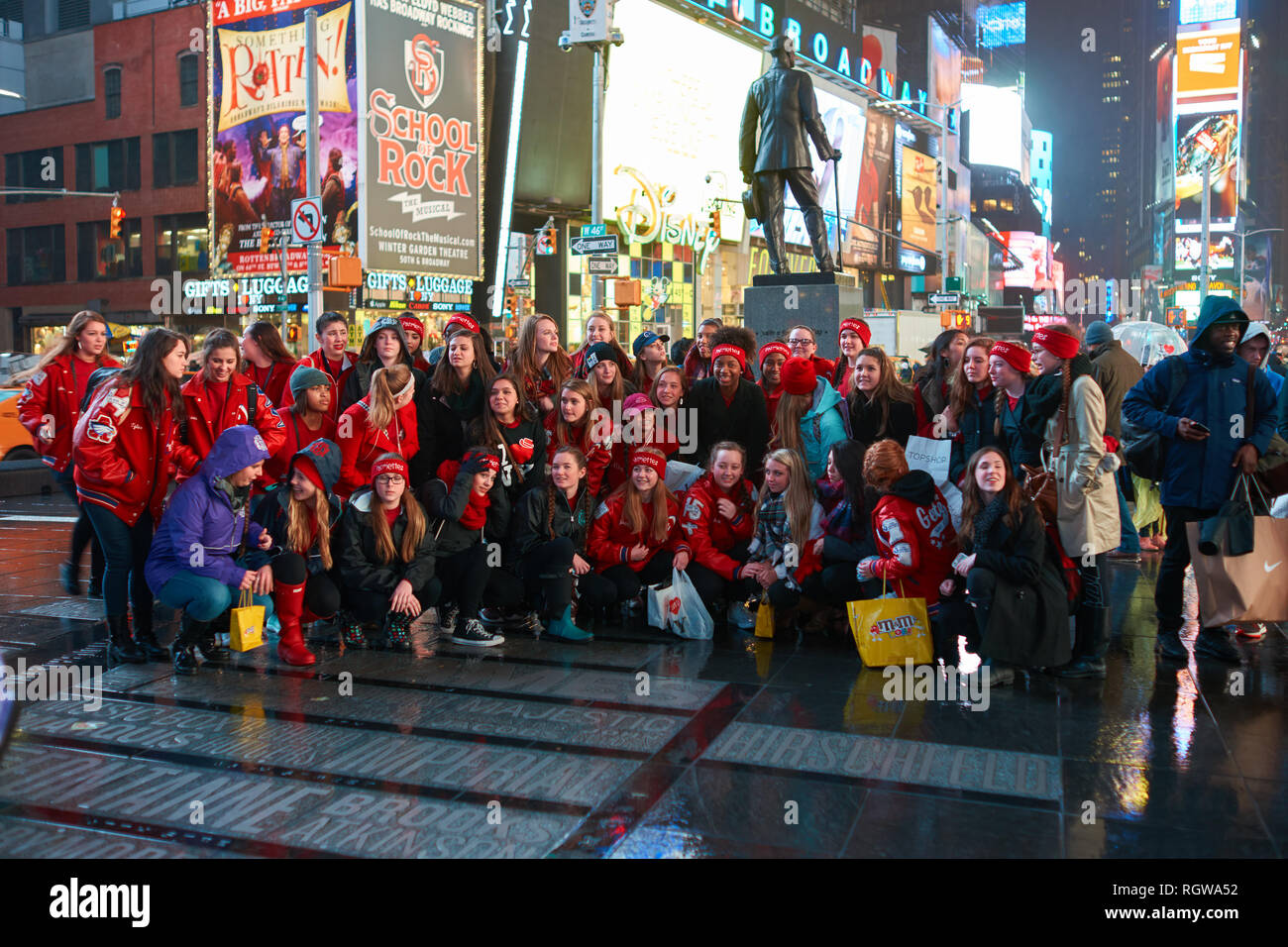 NEW YORK, NY - MARCH 14, 2016: a group of people posing in Times Square ...