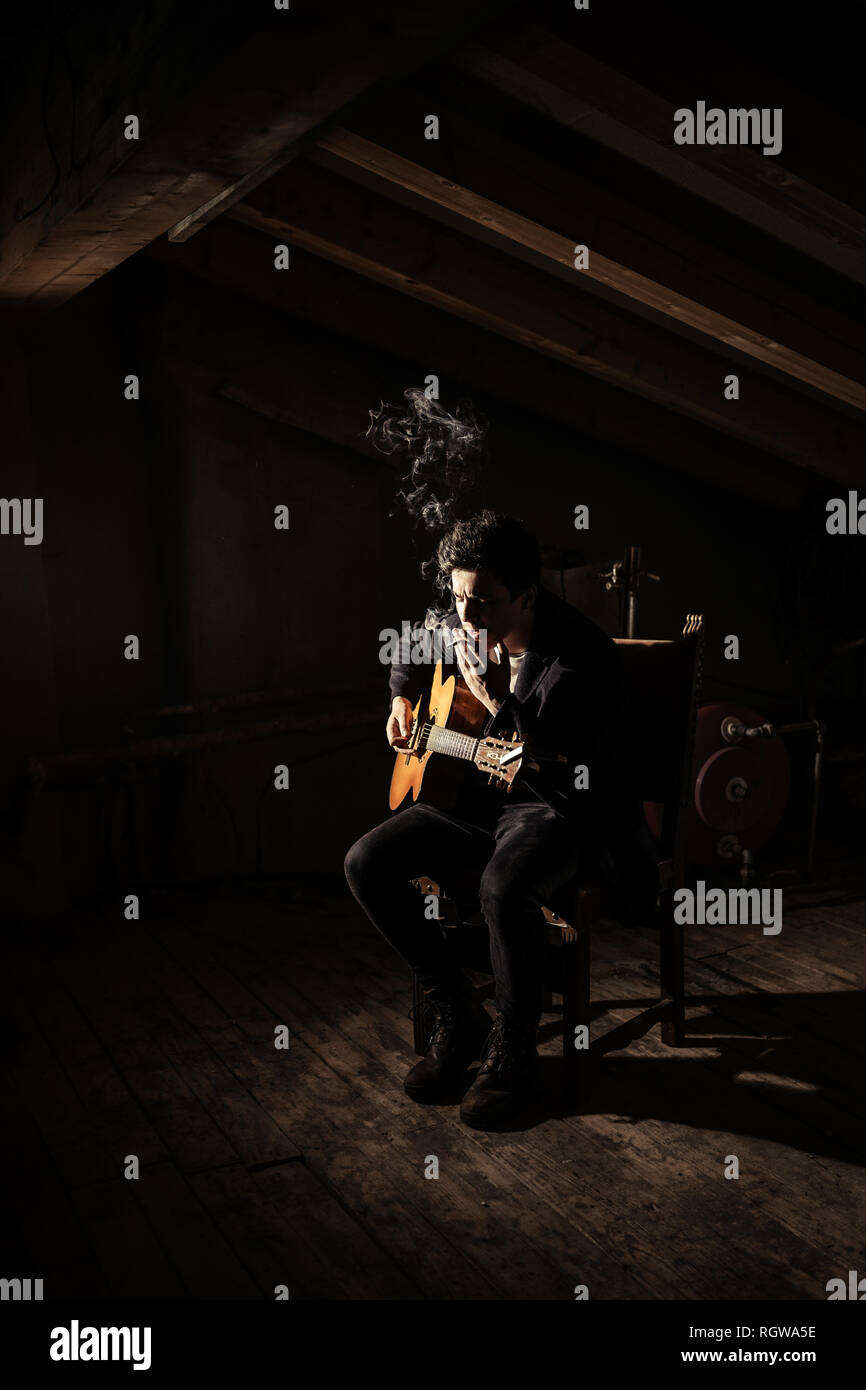 Playing guitar while smoking hi-res stock photography and images - Alamy