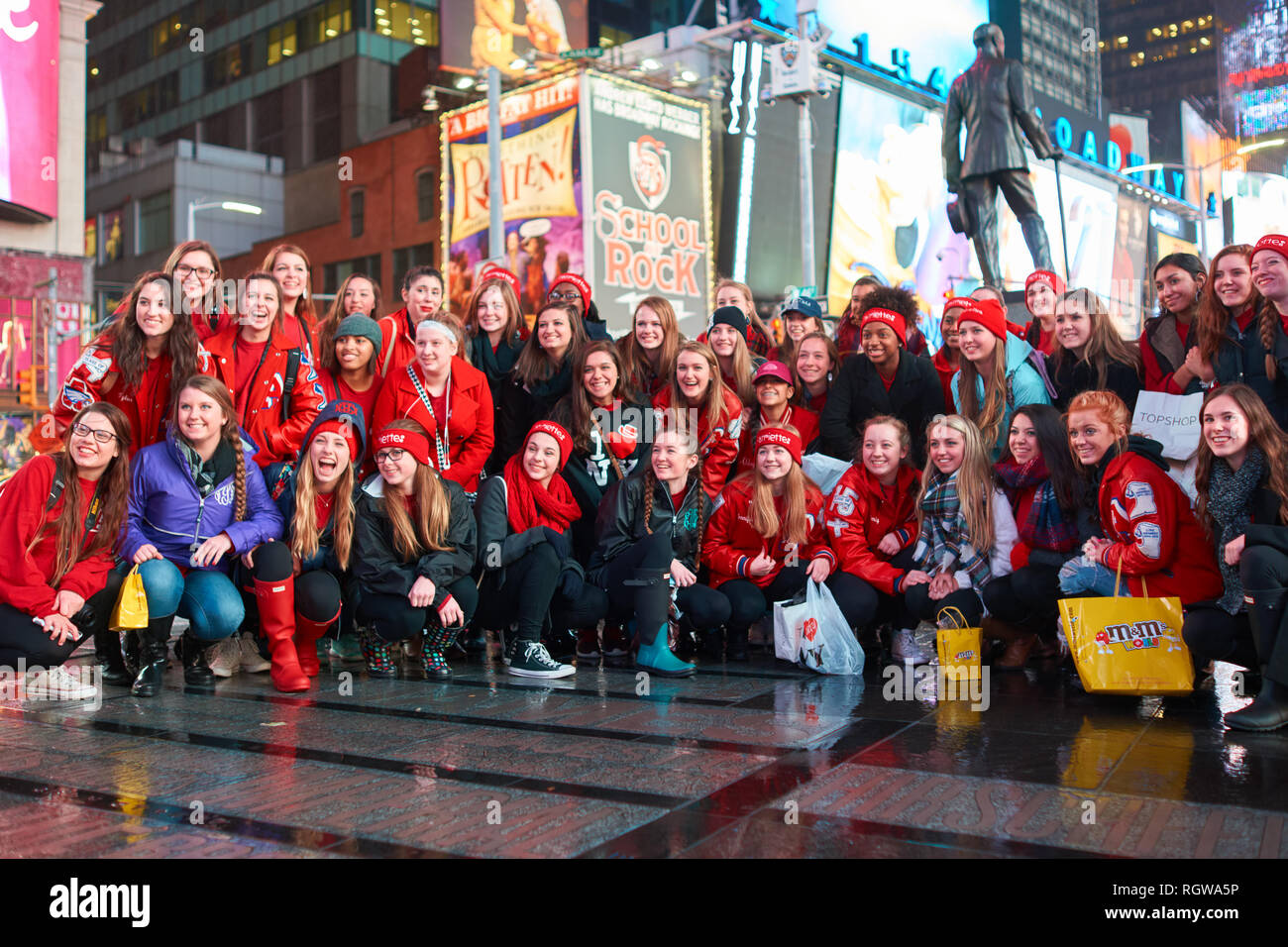 NEW YORK, NY - MARCH 14, 2016: a group of people posing in Times Square ...