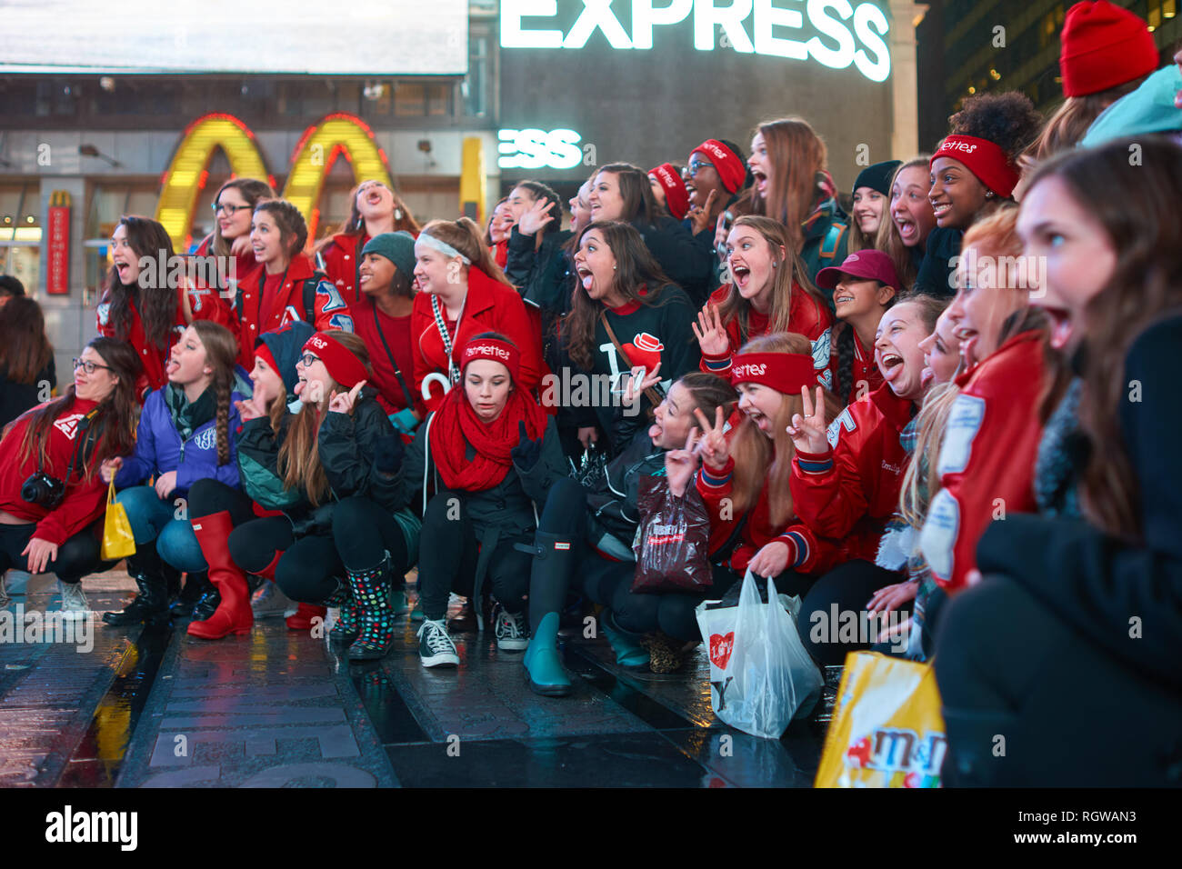 NEW YORK, NY - MARCH 14, 2016: a group of people posing in Times Square ...