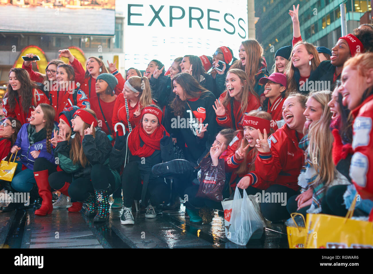 NEW YORK, NY - MARCH 14, 2016: a group of people posing in Times Square ...