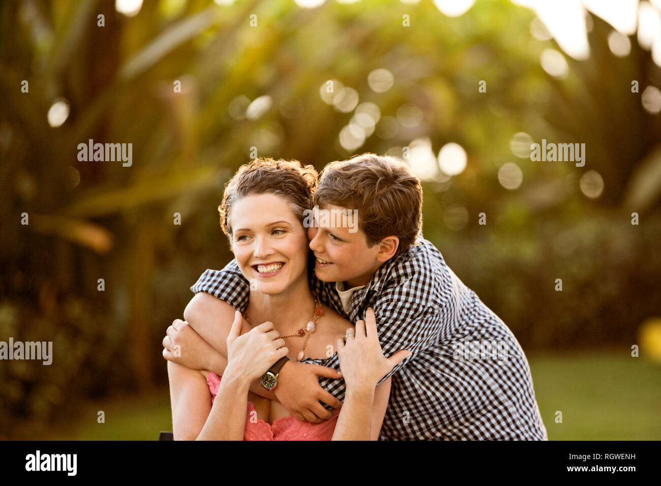 Woman hugging teen boy hi-res stock photography and images - Alamy
