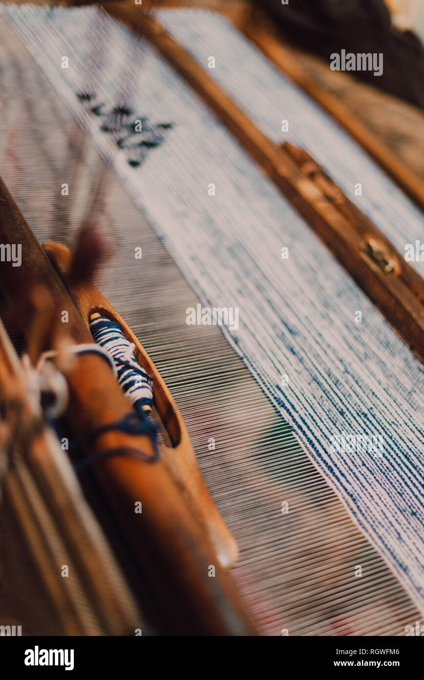Wooden loom with blue treads Stock Photo - Alamy