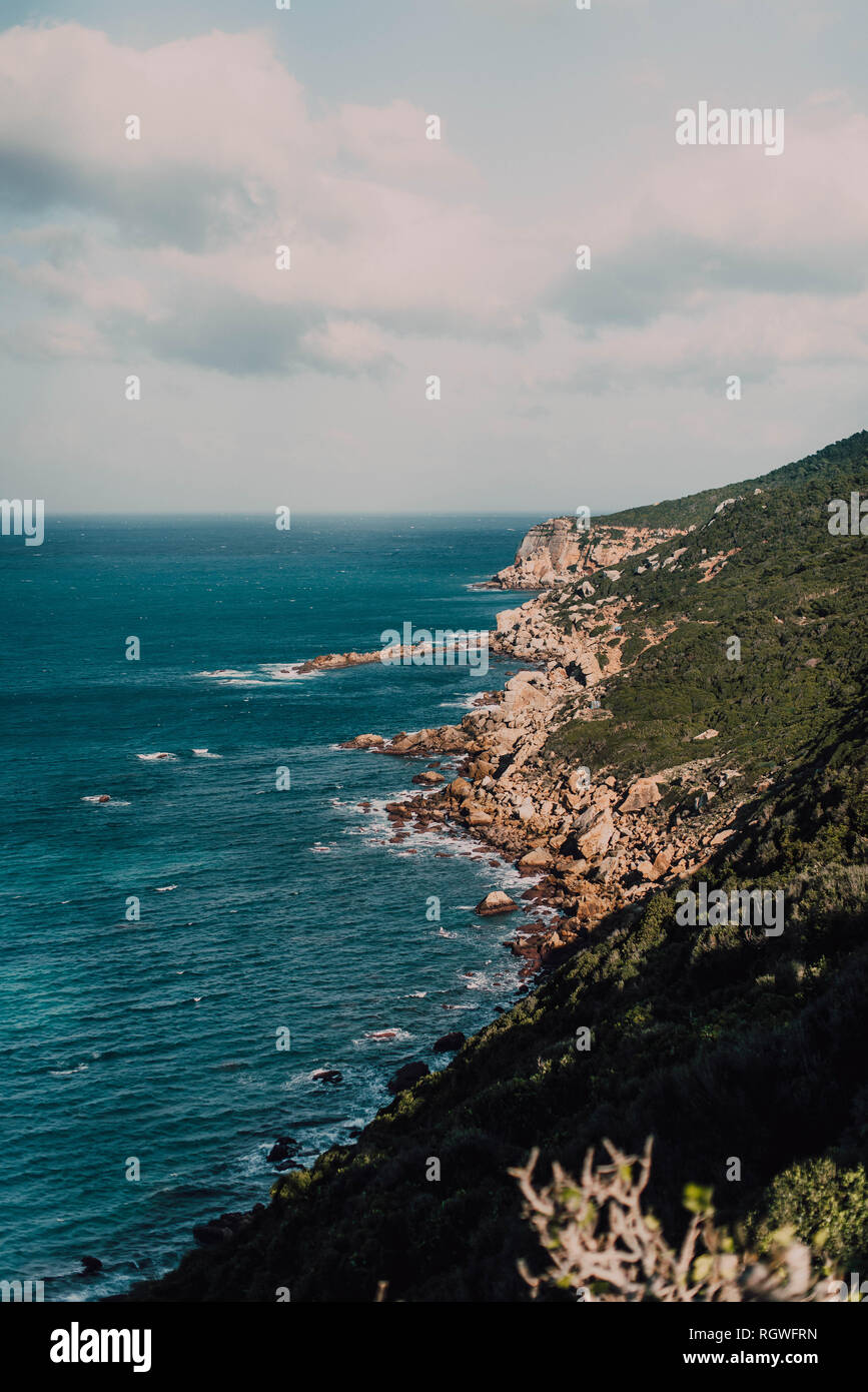 Stone shore near blue water Stock Photo - Alamy