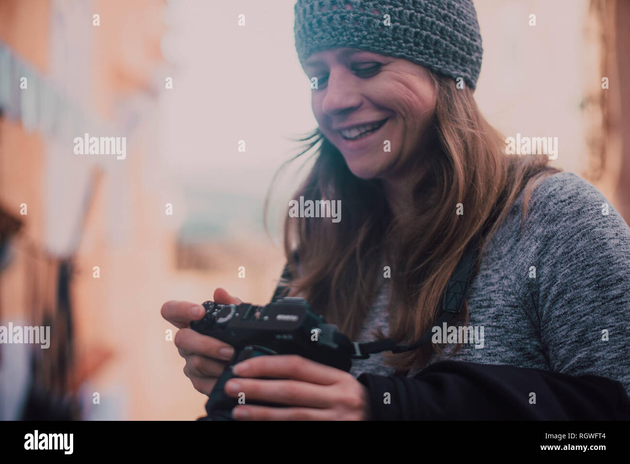 Laughing Woman with camera Stock Photo - Alamy
