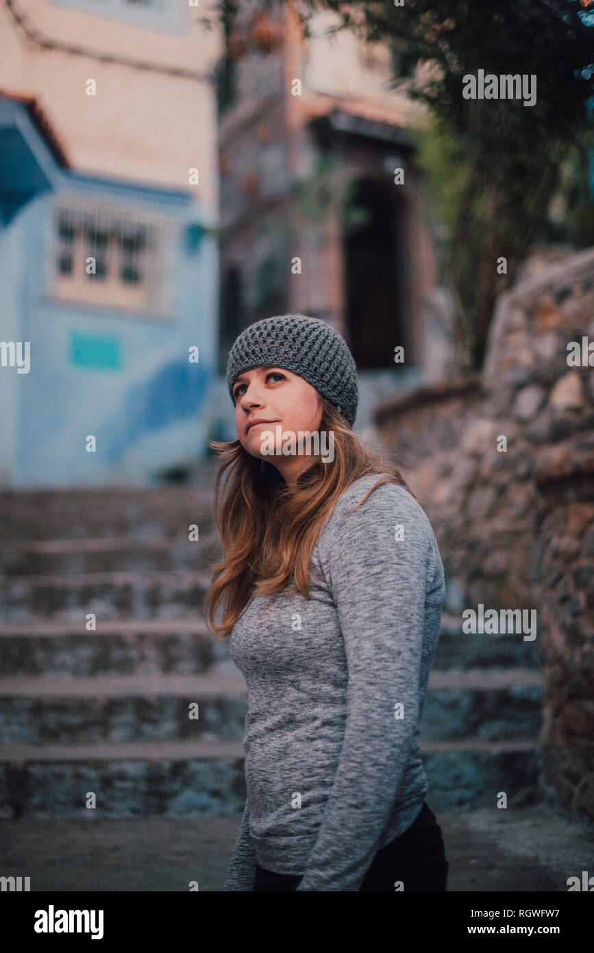 Pretty Woman at steps on street Stock Photo - Alamy