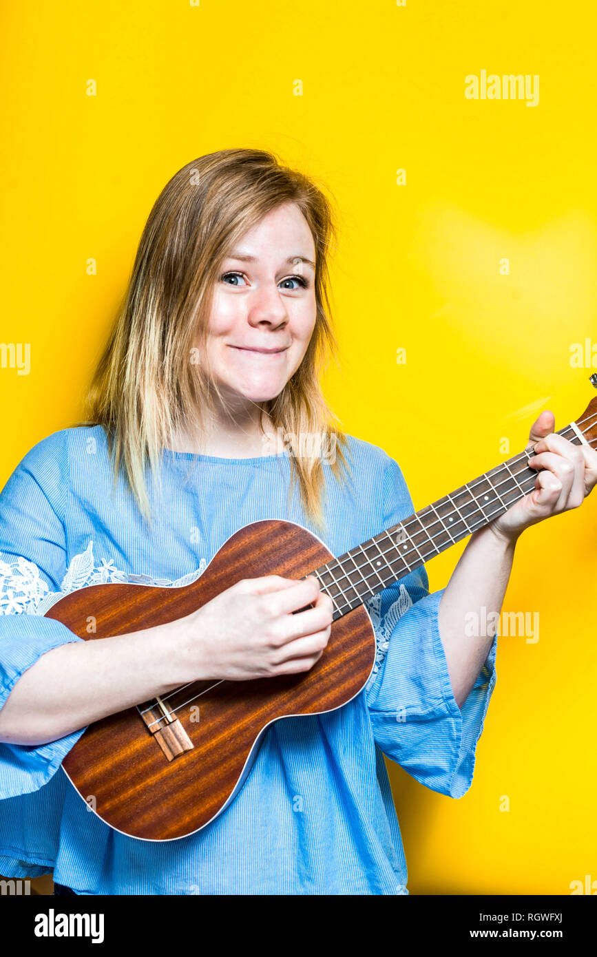 Pretty young woman ukulele hi-res stock photography and images - Alamy