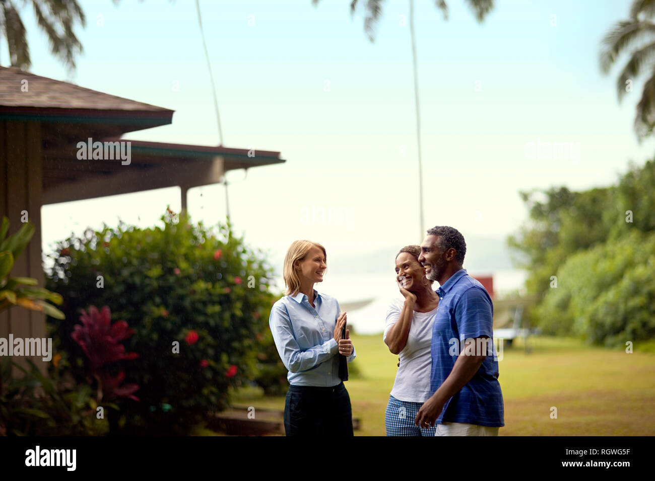 Real estate agent talking with her clients Stock Photo - Alamy