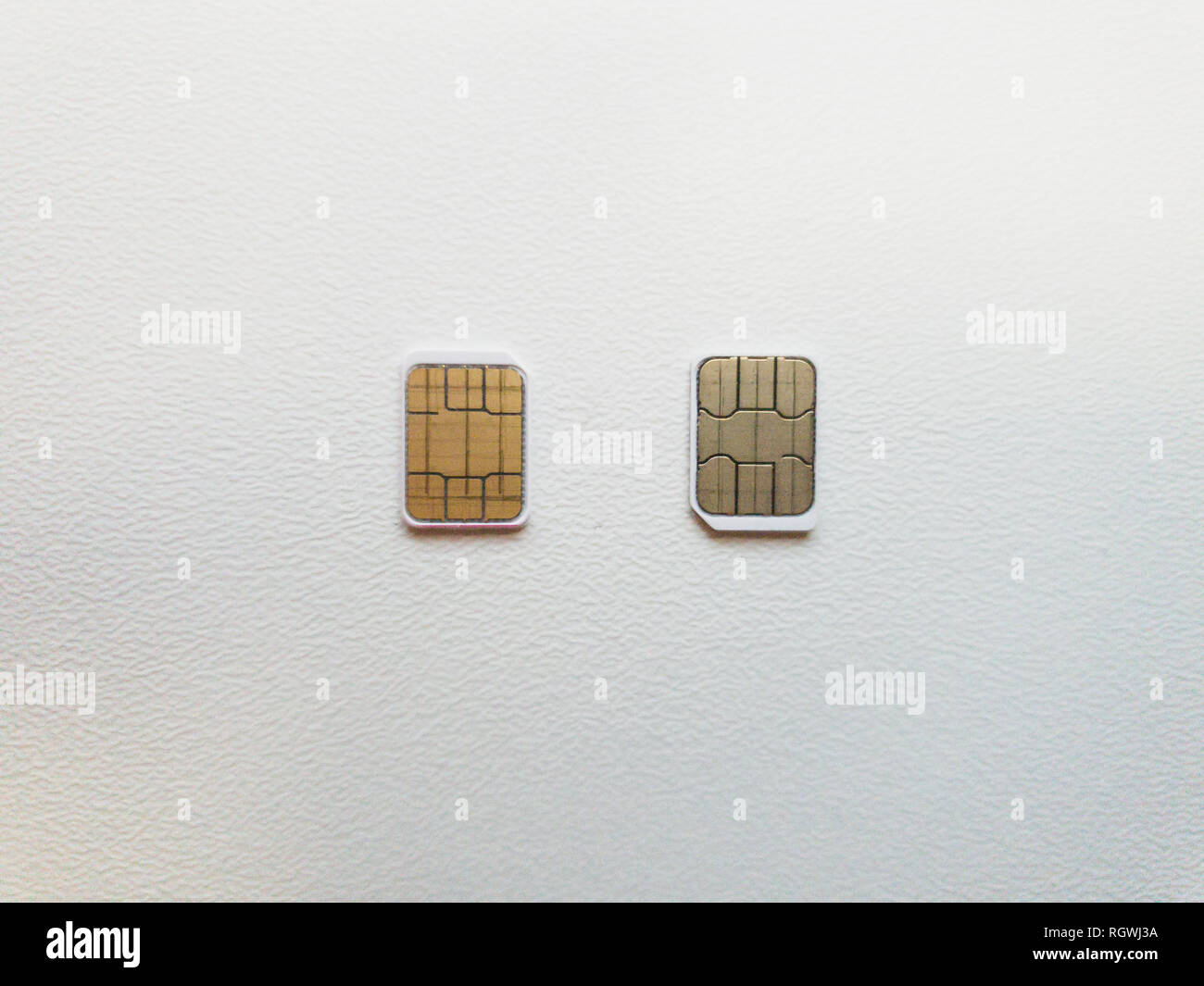 two micro sim cards on a light background surface67 Stock Photo - Alamy