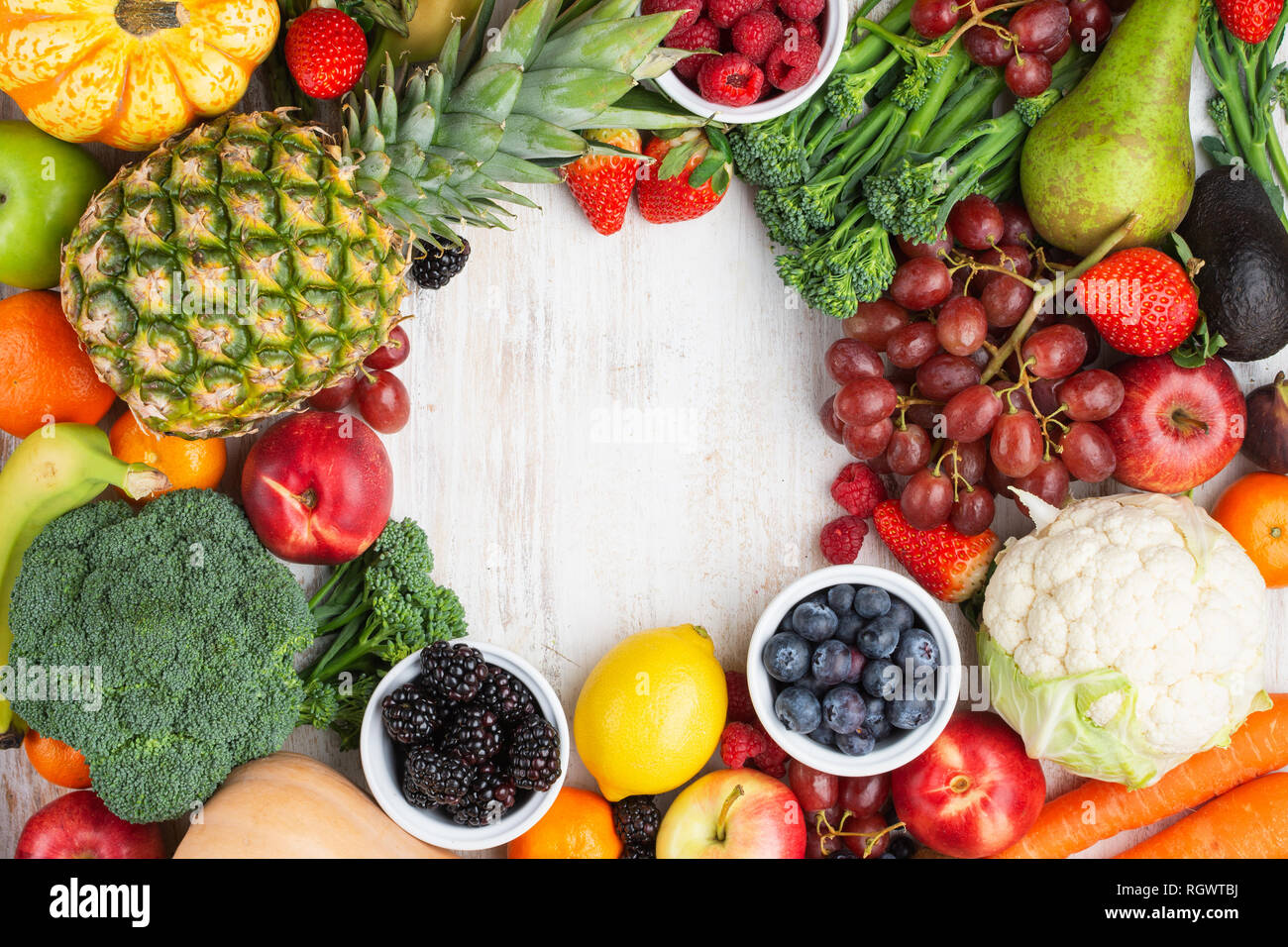 Healthy rainbow fruits vegetables berries frame, strawberries oranges ...