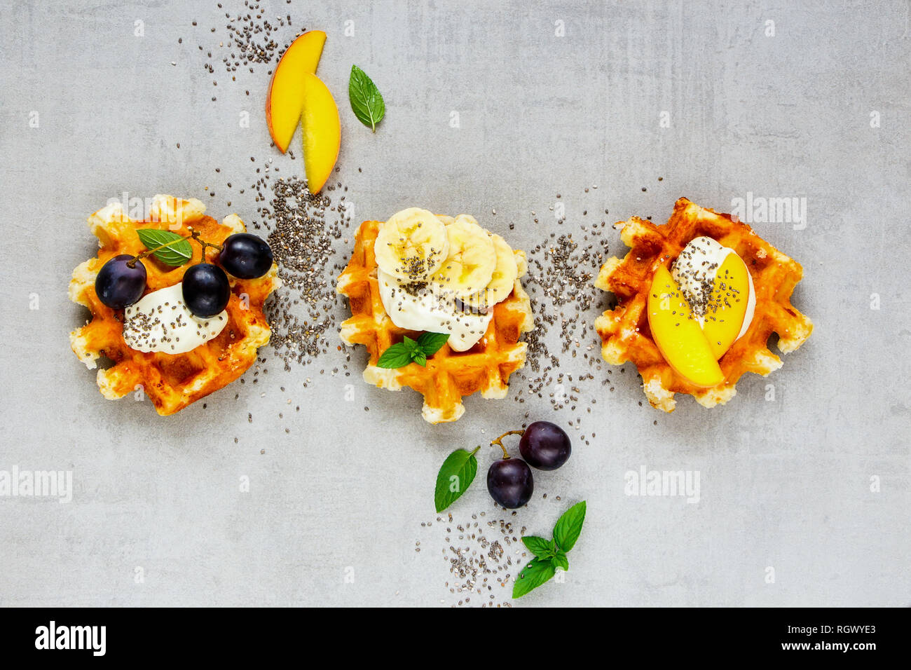 Fresh Traditional Belgian waffles, various fruits and whipped cream ...