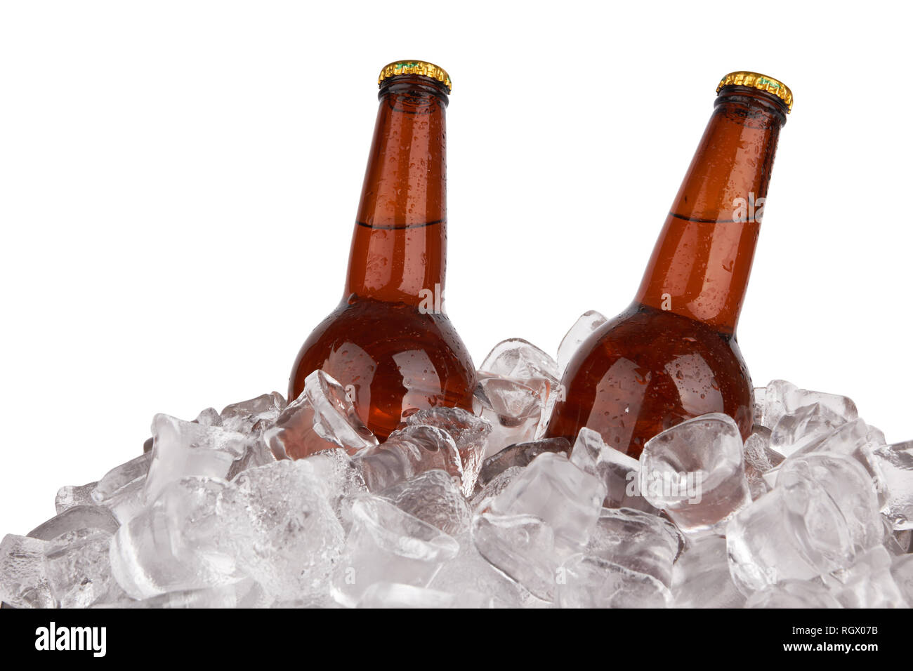 Two bottles of beer on ice isolated on white background Stock Photo - Alamy