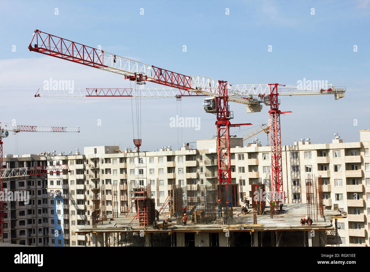 Building of the new high house by the crane Stock Photo - Alamy