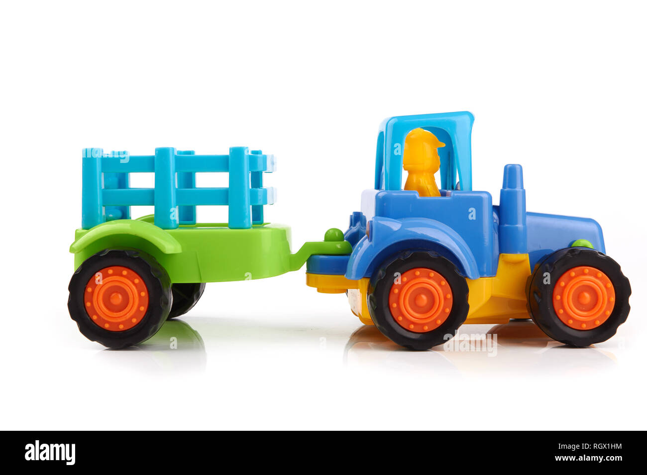 Blue toy tractor on a white background Stock Photo - Alamy