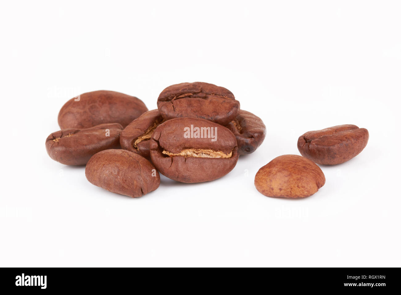 Roasted coffee beans poured Cut Out Stock Images & Pictures - Alamy