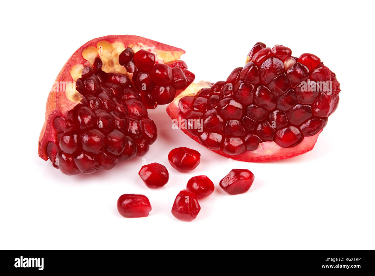 Broken pomegranate segment isolated on white background Stock Photo - Alamy