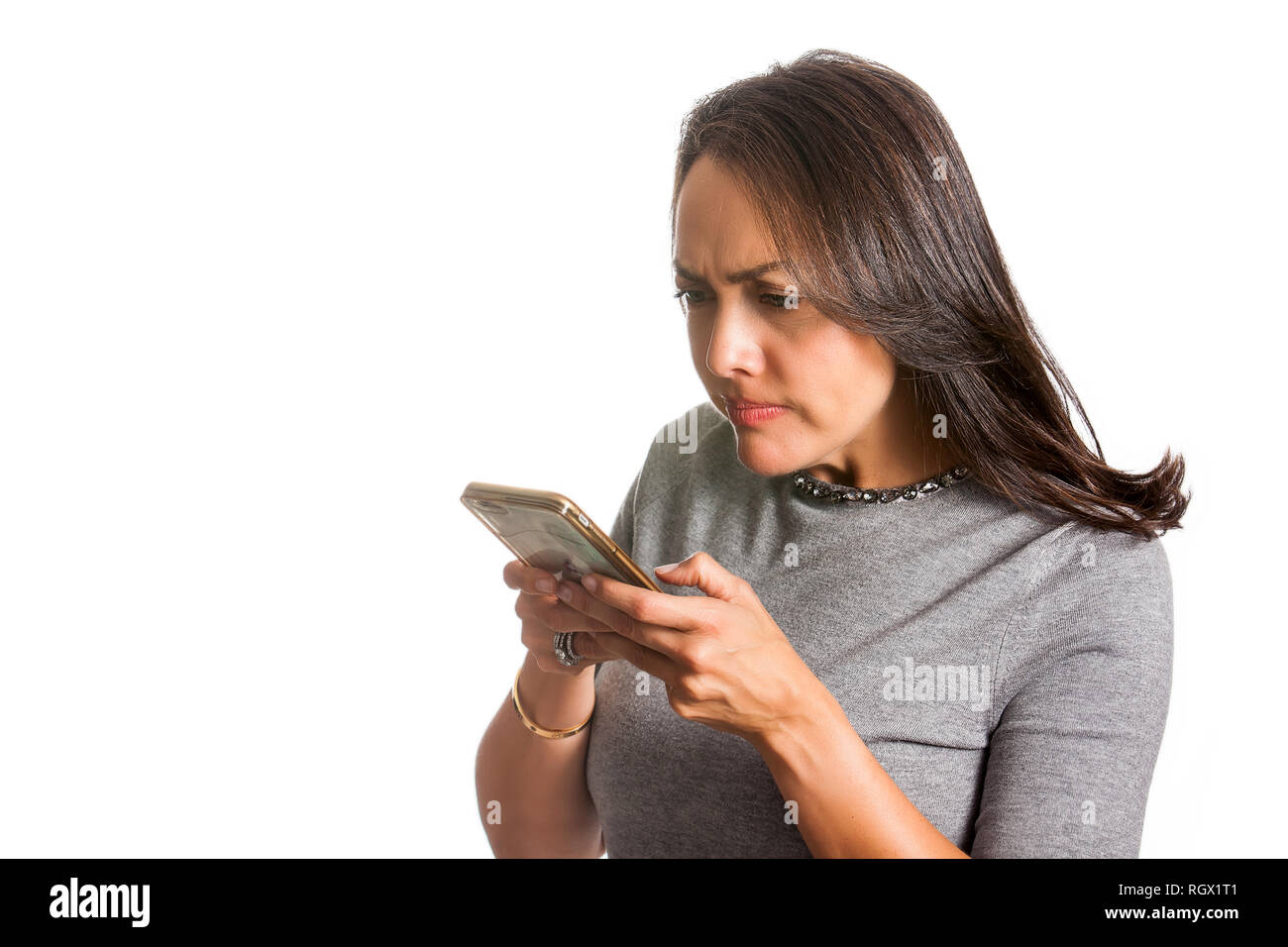 Angry woman texting on her cellphone isolated on white background Stock ...