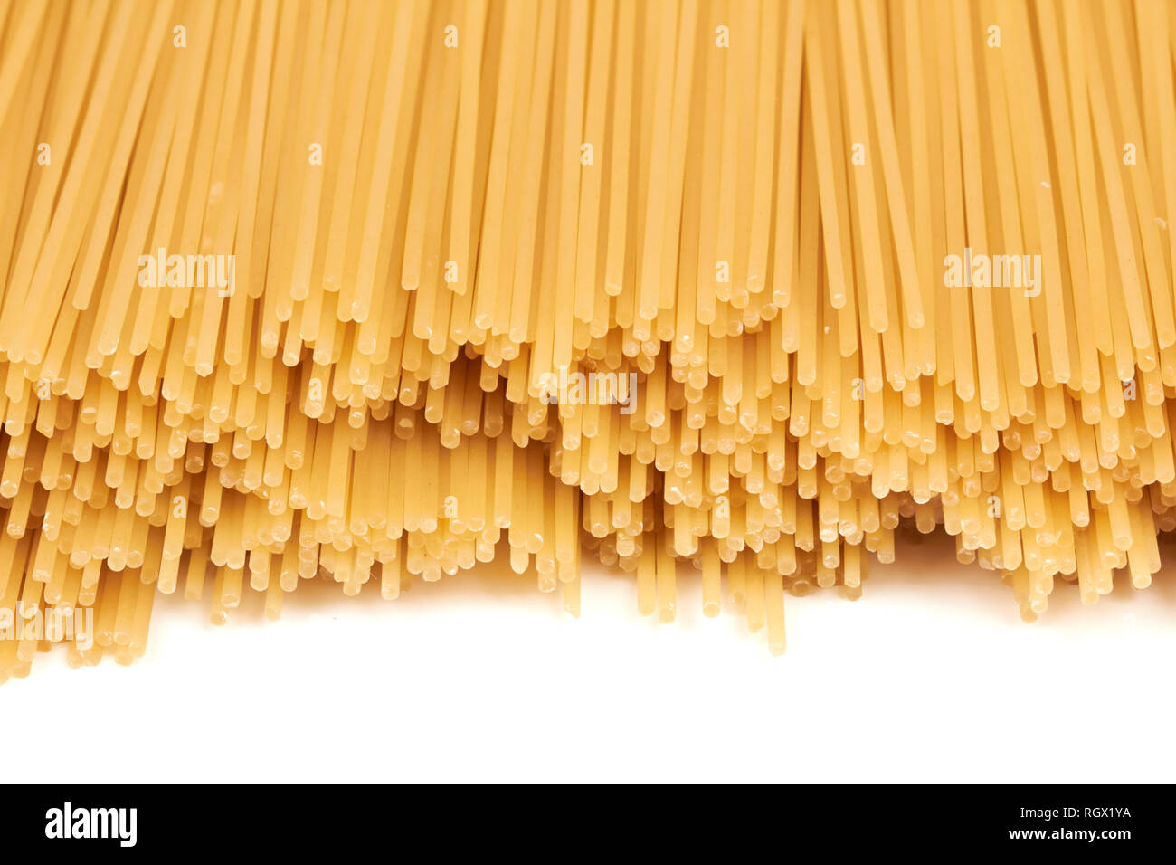 Raw spaghetti isolated on a white background Stock Photo - Alamy