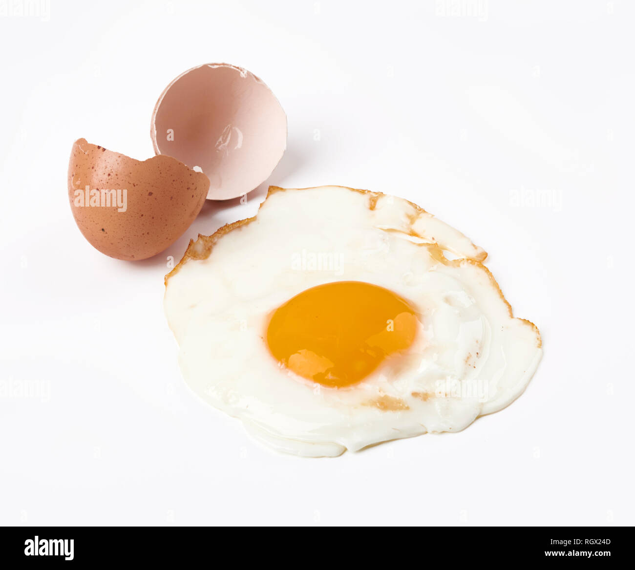 Fried egg isolated on a white background Stock Photo - Alamy