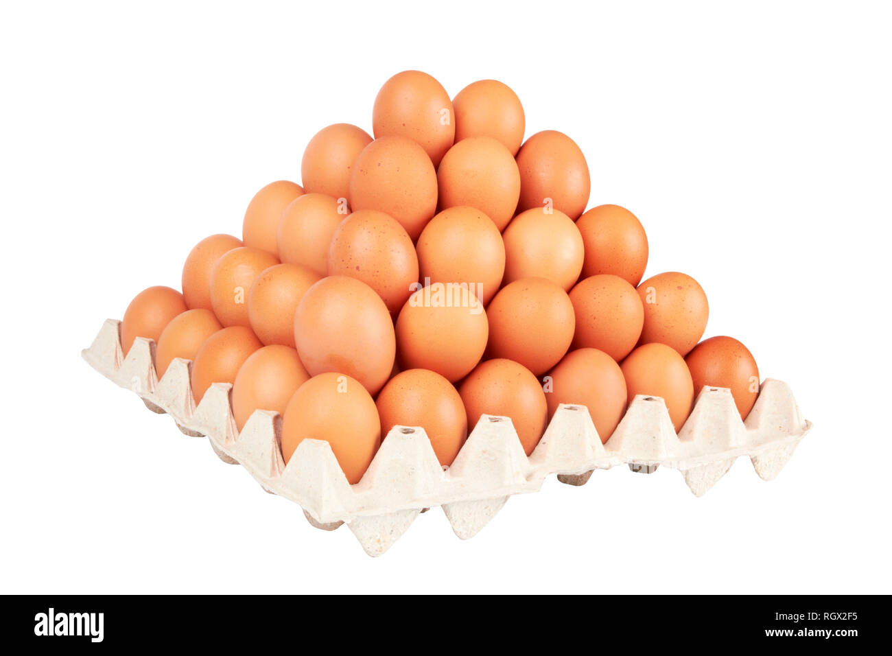pyramid of brown eggs isolated on white background Stock Photo - Alamy