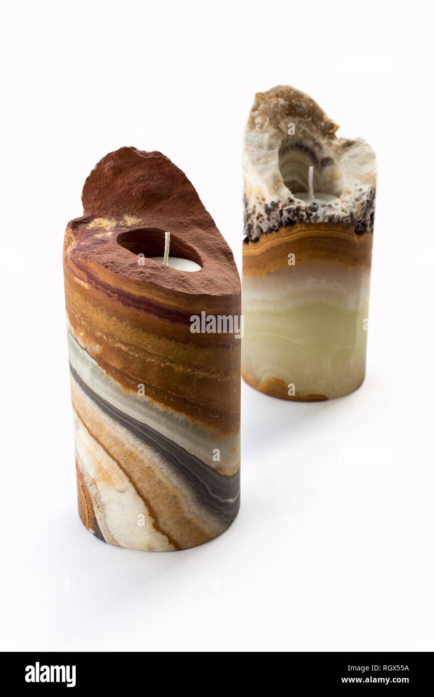 two hand carved marble candles with white background Stock Photo - Alamy