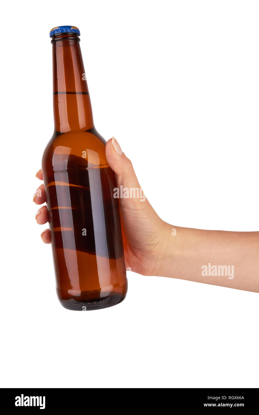 hand holding a brown beer bottle without label isolated on white ...