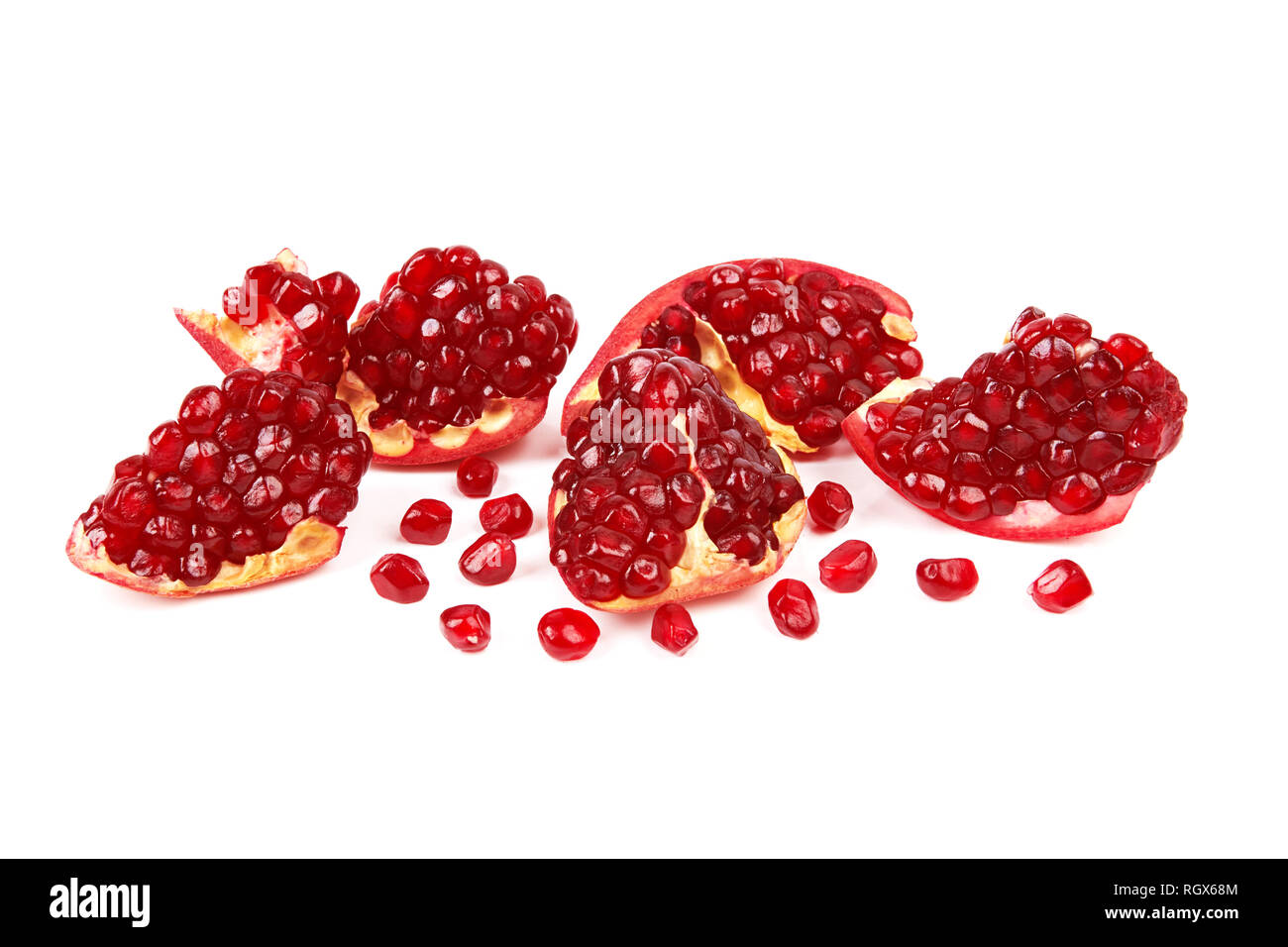 Broken pomegranate segment isolated on white background Stock Photo - Alamy