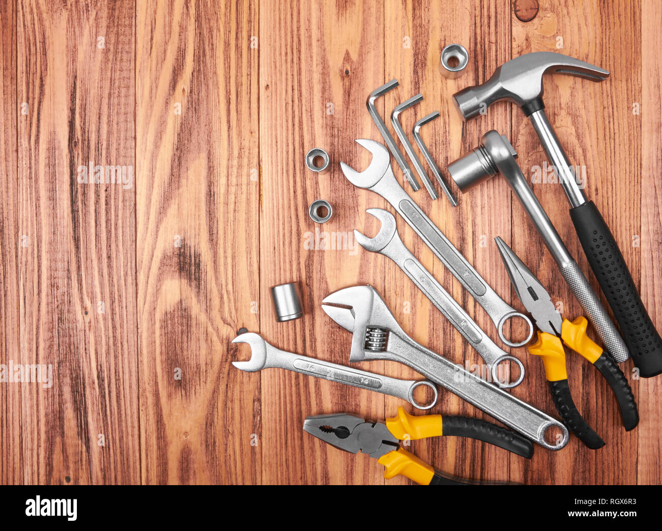 Different kinds of tools on wooden background Stock Photo - Alamy