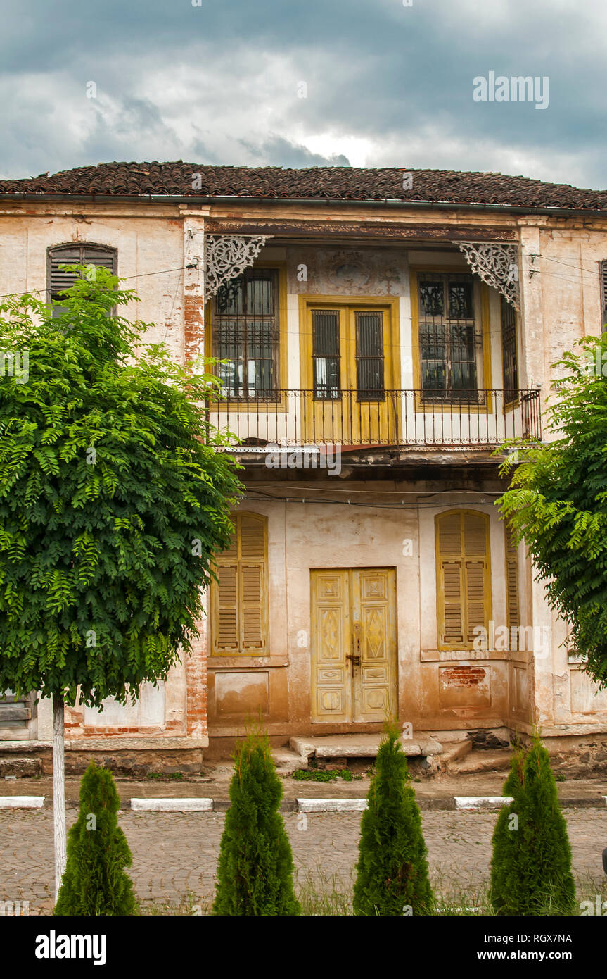 Old abandoned vintage retro country house and neglected stone slabs ...
