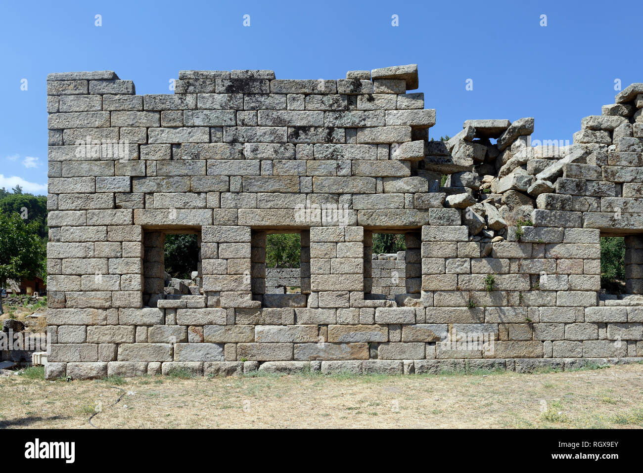 The left side of the 4th century BC Andron A with has windows ...