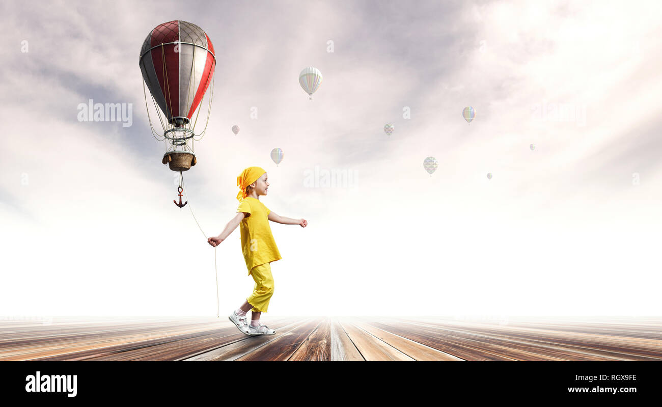 Little kid girl with aerostat balloon walking alone. Mixed media Stock ...
